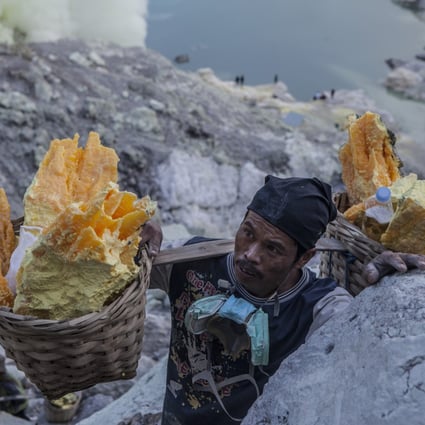 Why miners in Indonesia risk their lives to get sulphur from inside an ...