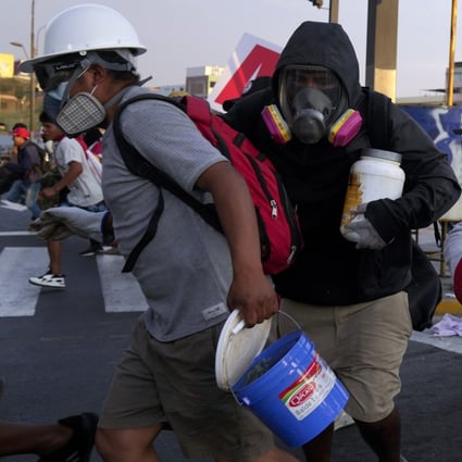 The Protest ‘deactivators In Peru Who Run Toward Tear Gas To Stop It South China Morning Post