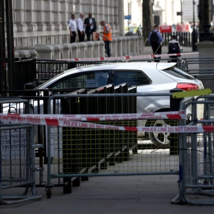 Man arrested after car crashes into gates of Downing Street, where UK ...