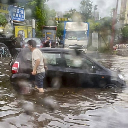 Downpour lashes Hong Kong with red rainstorm warning in force for 2 ...