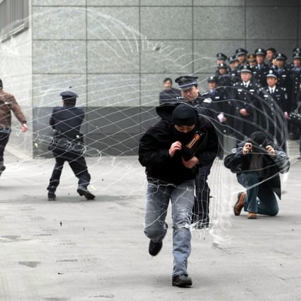 Tasers and net guns for Hong Kong police? Bad idea | South China ...