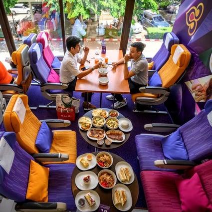 In Thailand, a cafe made to look like an aircraft cabin and an actual ...
