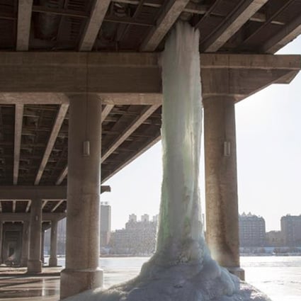 Big freeze: dripping pipe creates huge ice pillar in China’s frozen ...
