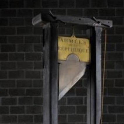 Next on the block, a working guillotine with a few dents on the blade ...