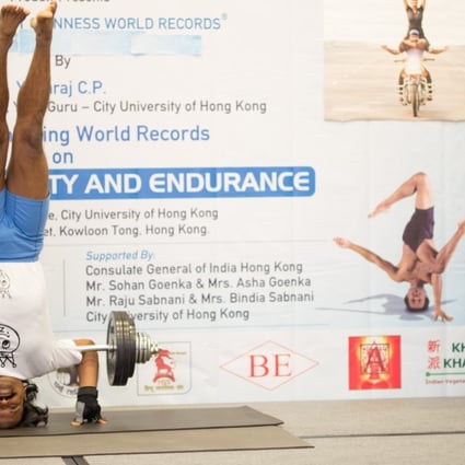 Hong Kong yogi breaks Guinness World Records for headstand and human ...